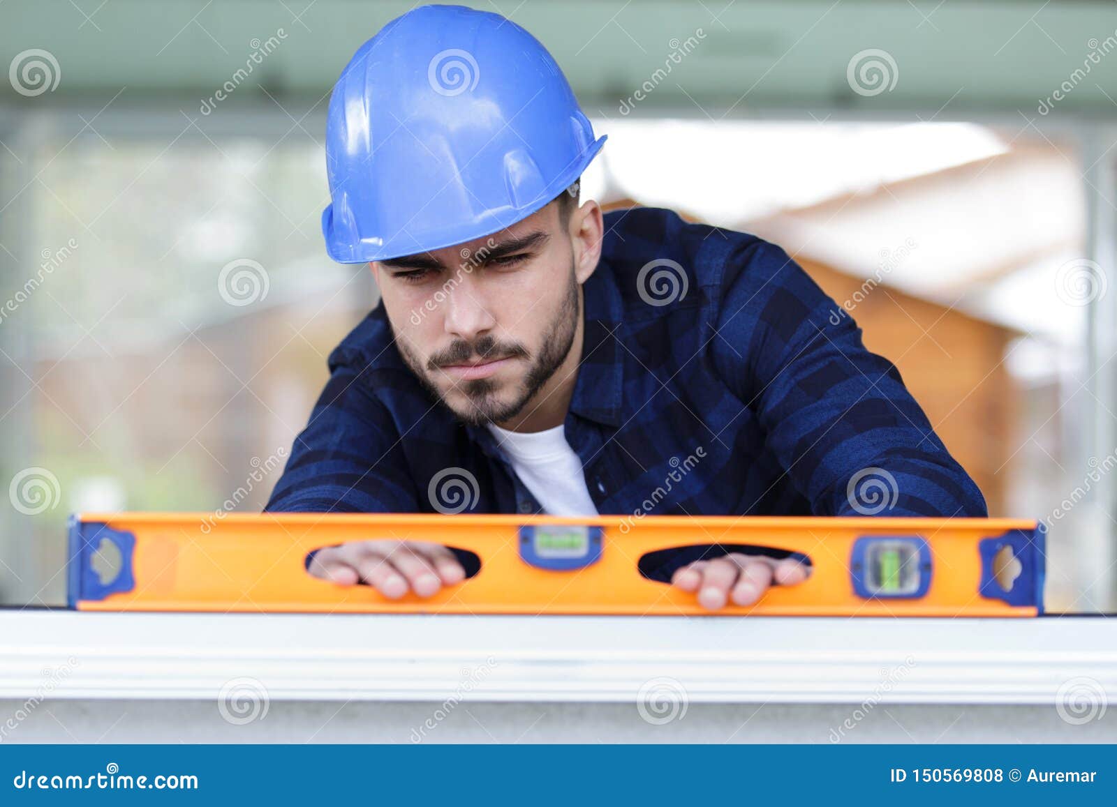 Building level in hands stock photo. Image of hands - 150569808