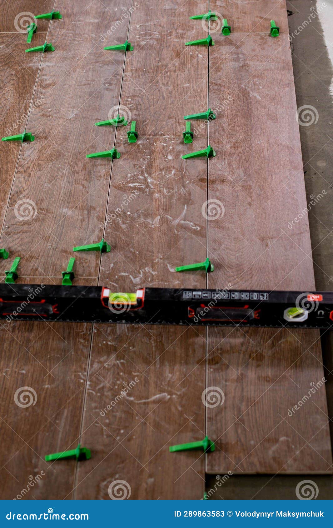 Building Level and Tile Clips for Lying on the Floor Stock Image ...