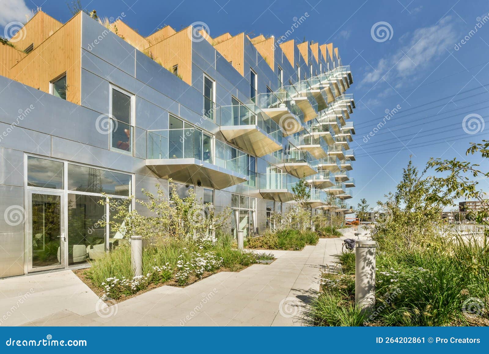 A Building with Many Balconies and a Sidewalk Stock Image - Image of ...