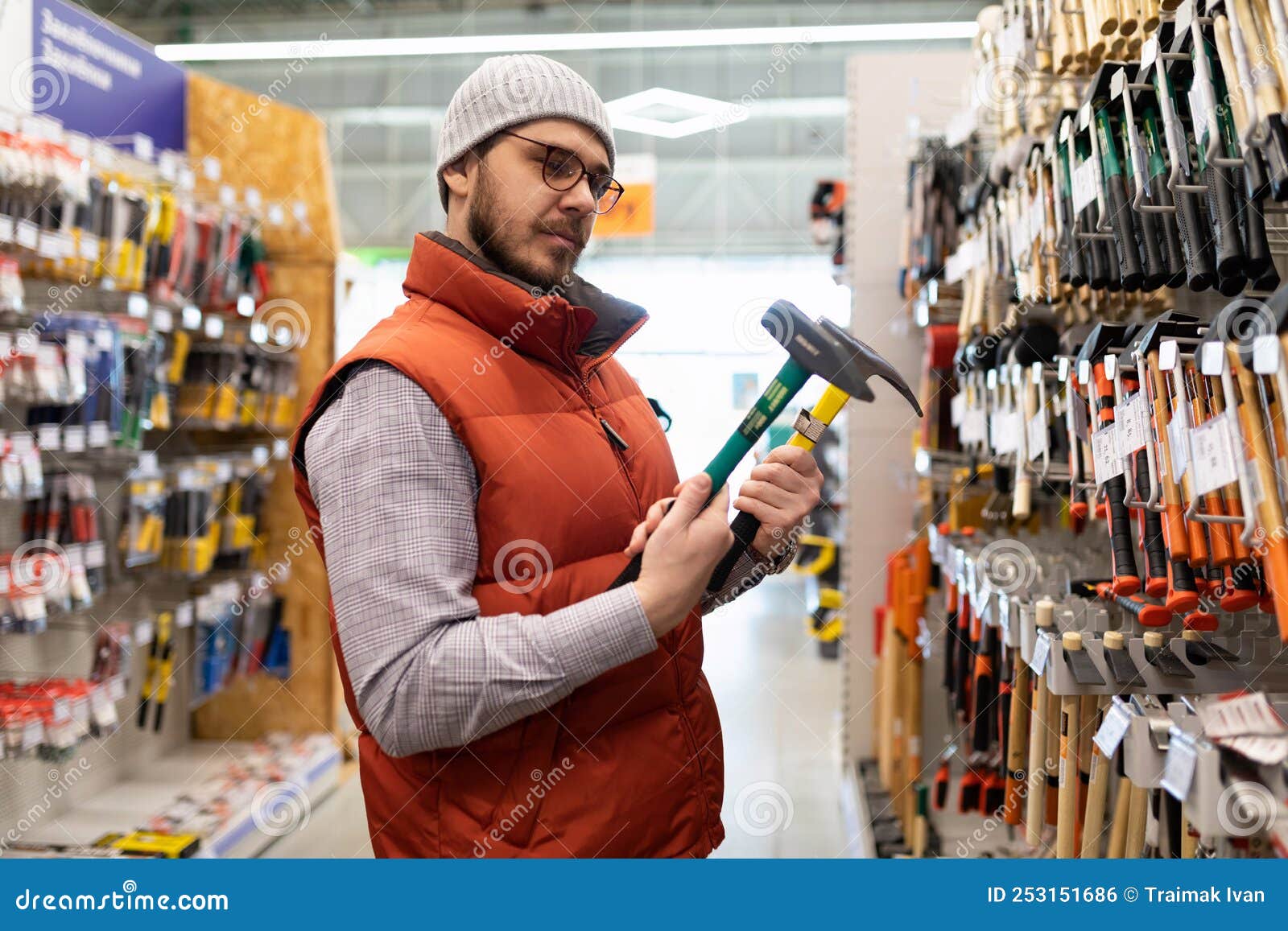 Building Materials Stores a Man Chooses a New Hammer Stock Photo ...