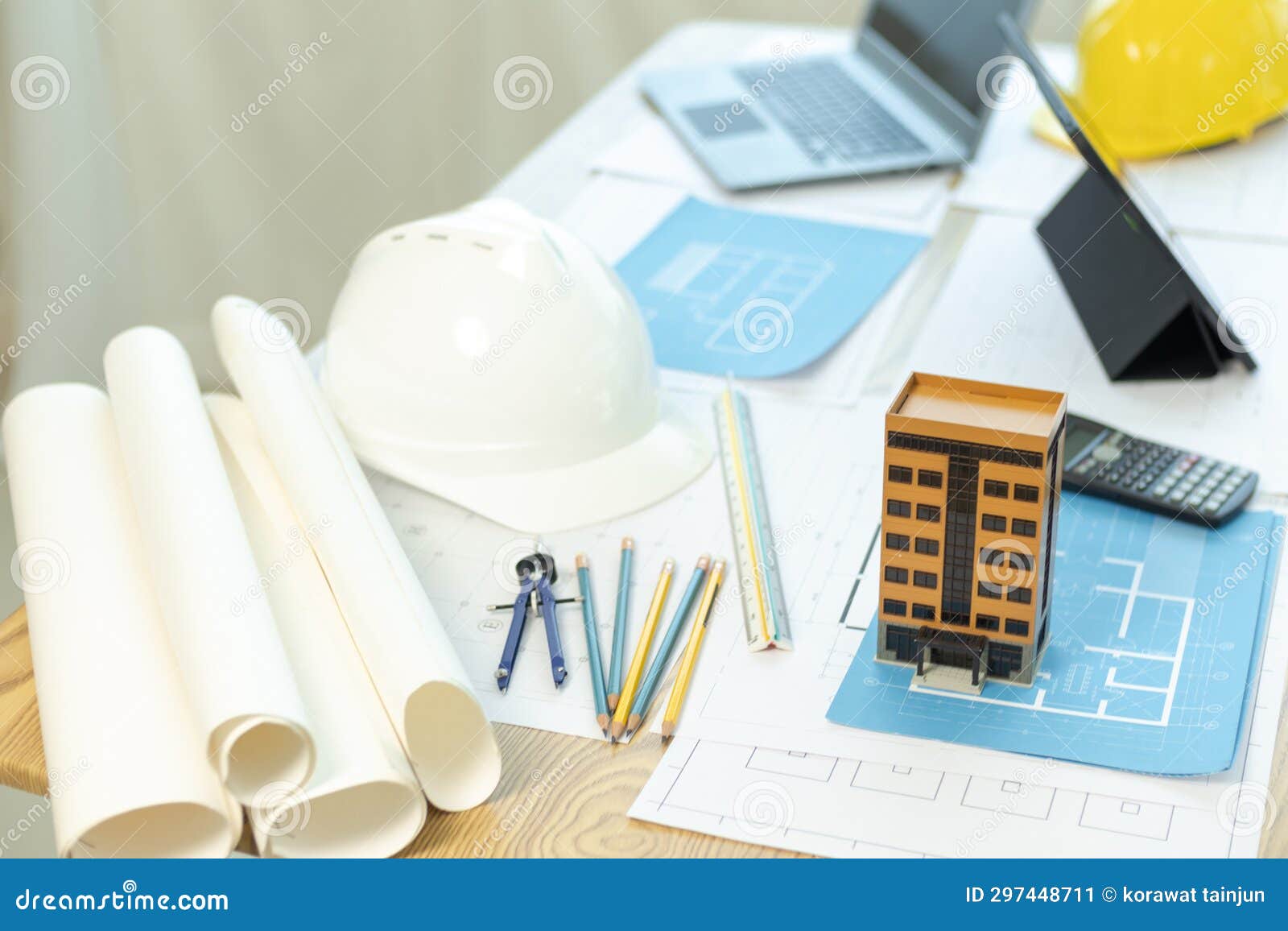 Building Models and Blueprints are Placed on Work Desks in the ...