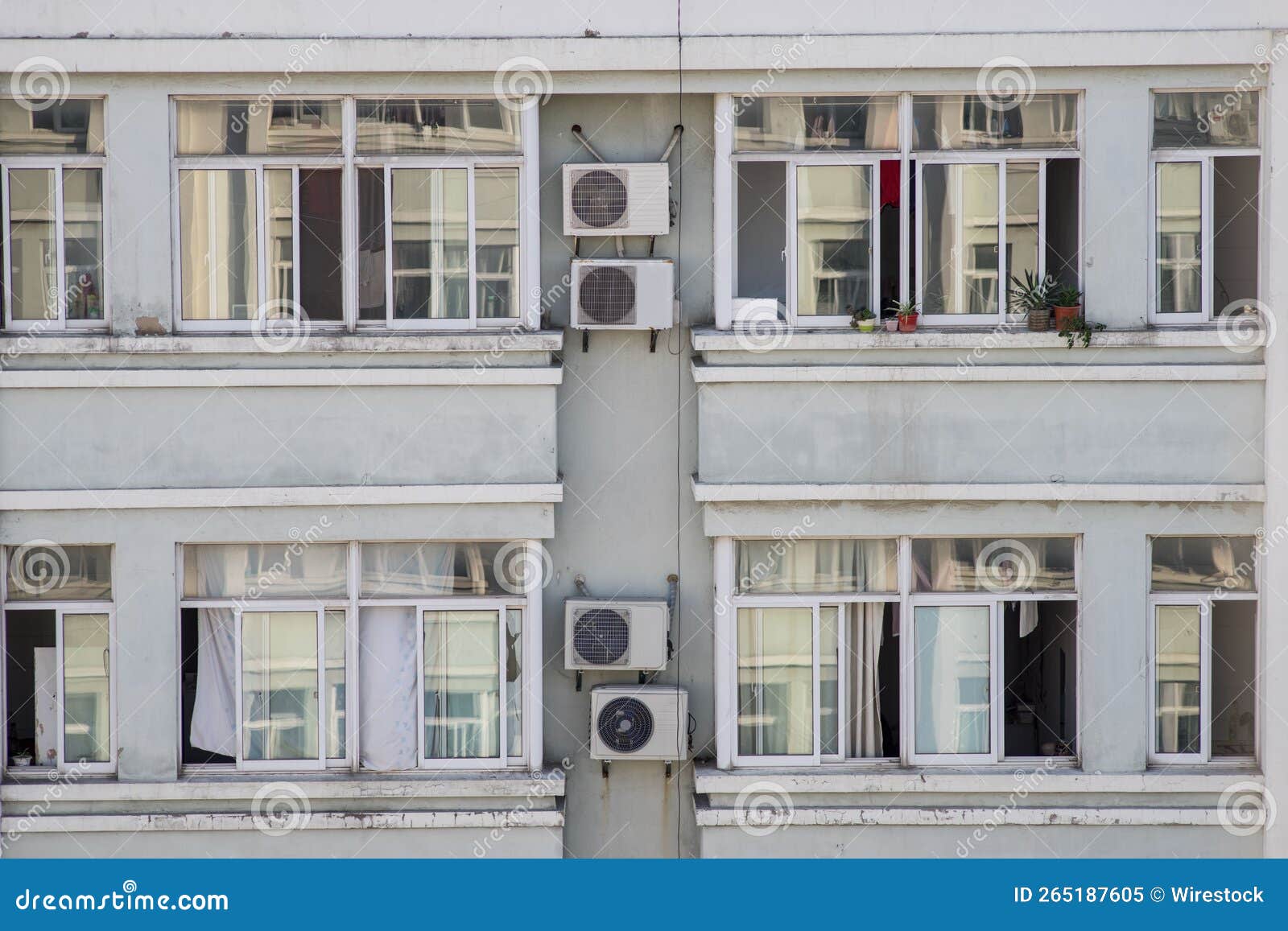 Building with Open Windows and Air Conditioners. Stock Image - Image of ...