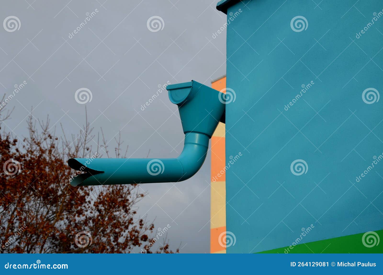 A Building Painted Turquoise, Including a Gutter and a Water Spout ...