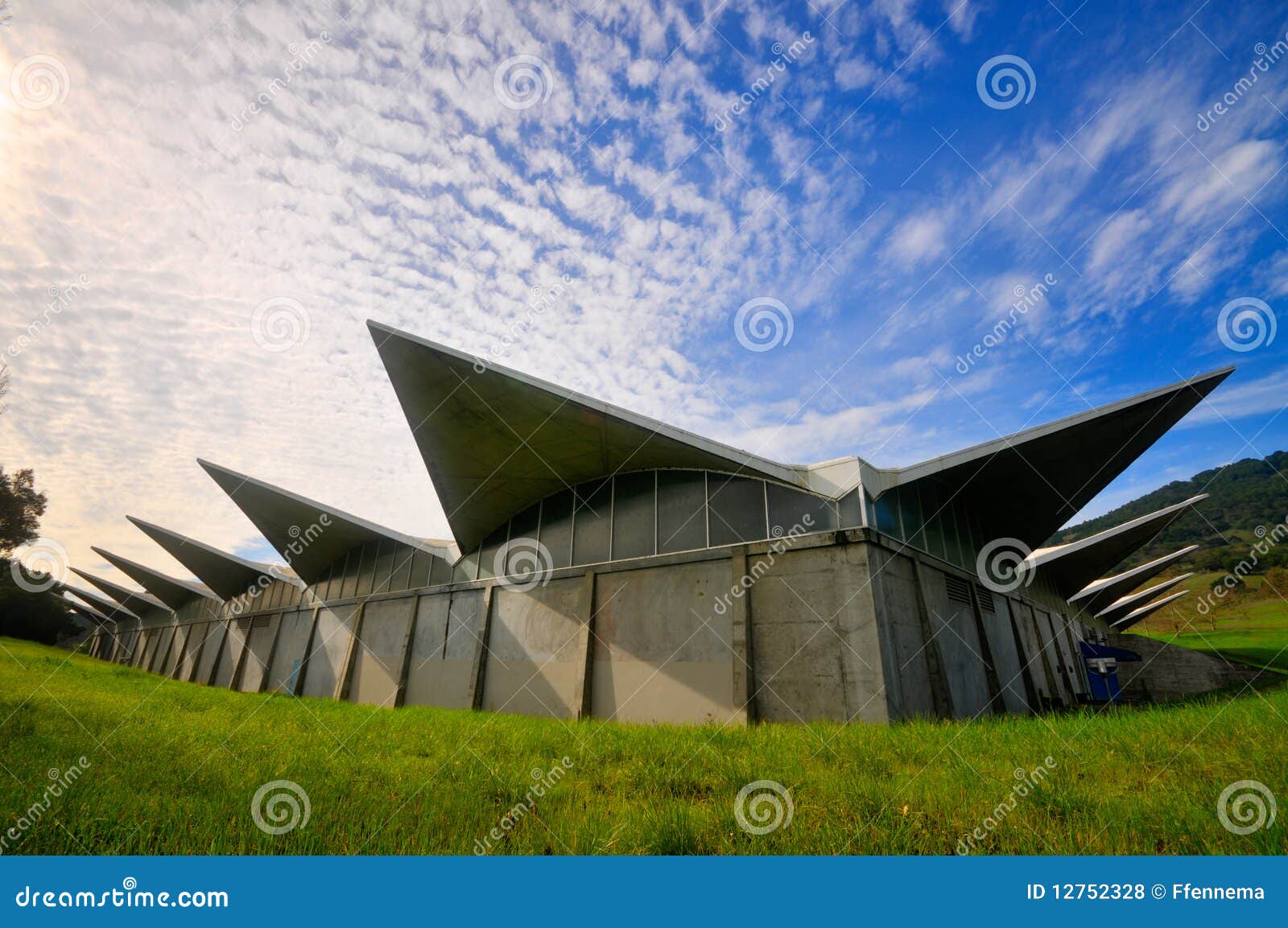 Building with Pointed Roof Surrounded by Grass Stock Photo - Image of ...