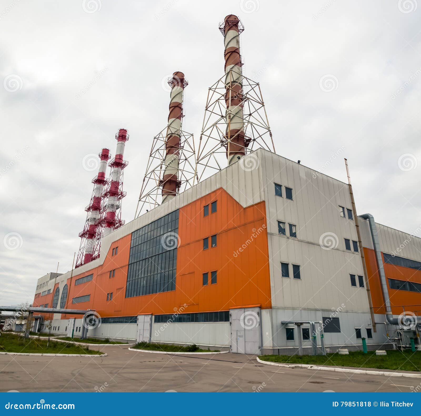 Building of Power Generation Station with Pipes on Gray Sky Stock Photo ...