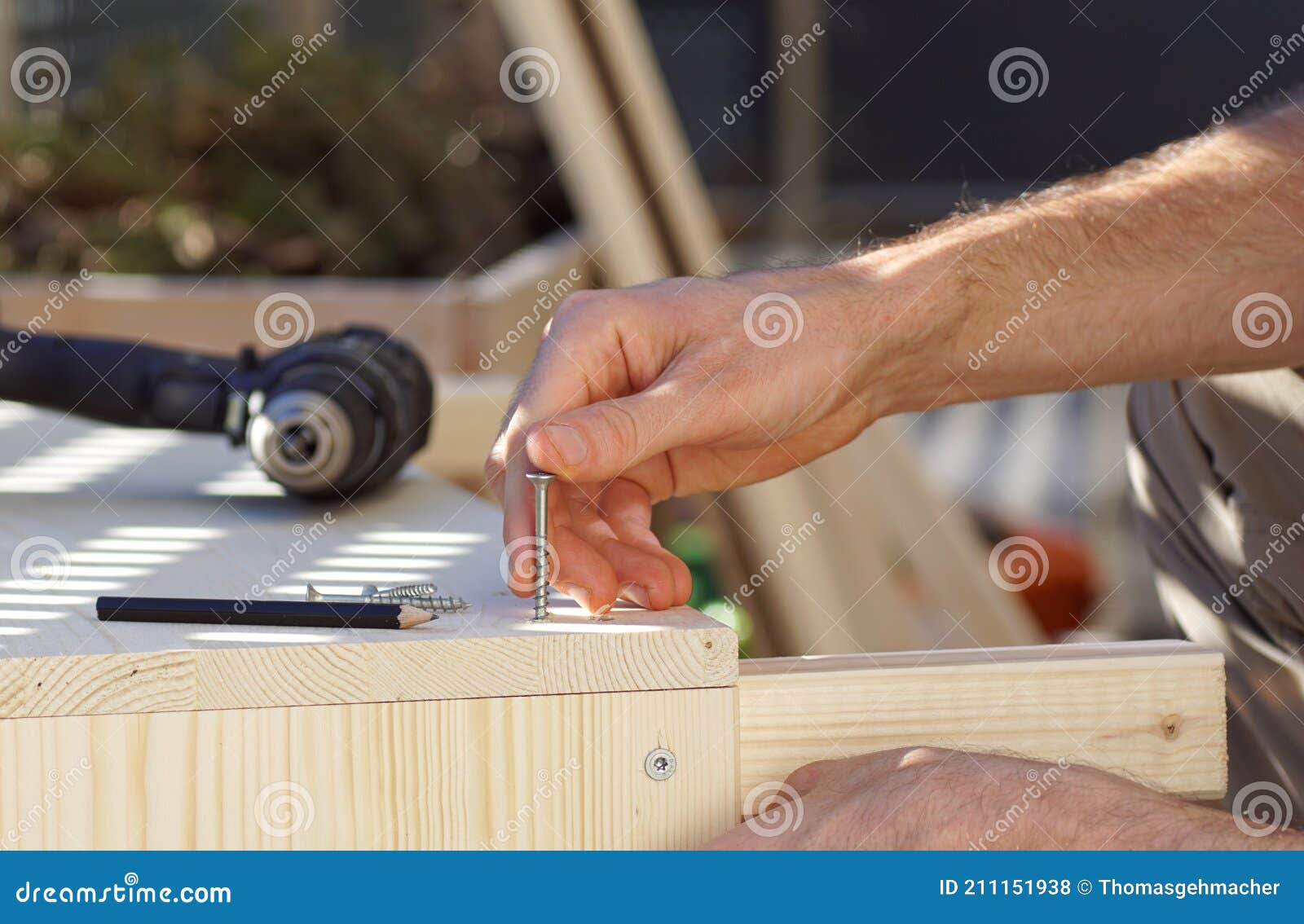 View of a Hand Placing a in a Timber Beam Stock Photo - Image of ...