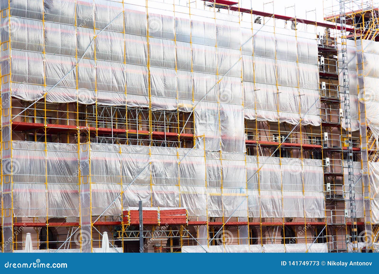 Scaffolding Covered With Fabric On A High-rise Building Stock ...