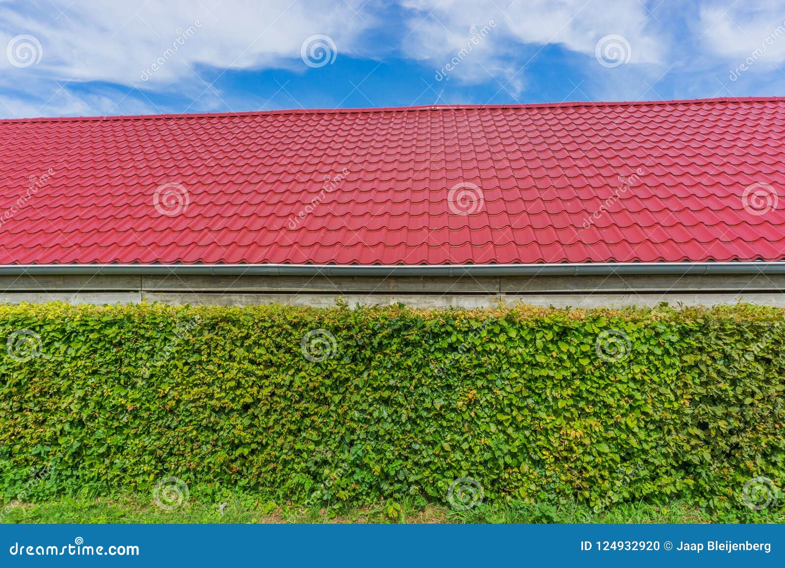 Building with Red Rooftop Tiling and Hedge Stock Photo - Image of ...