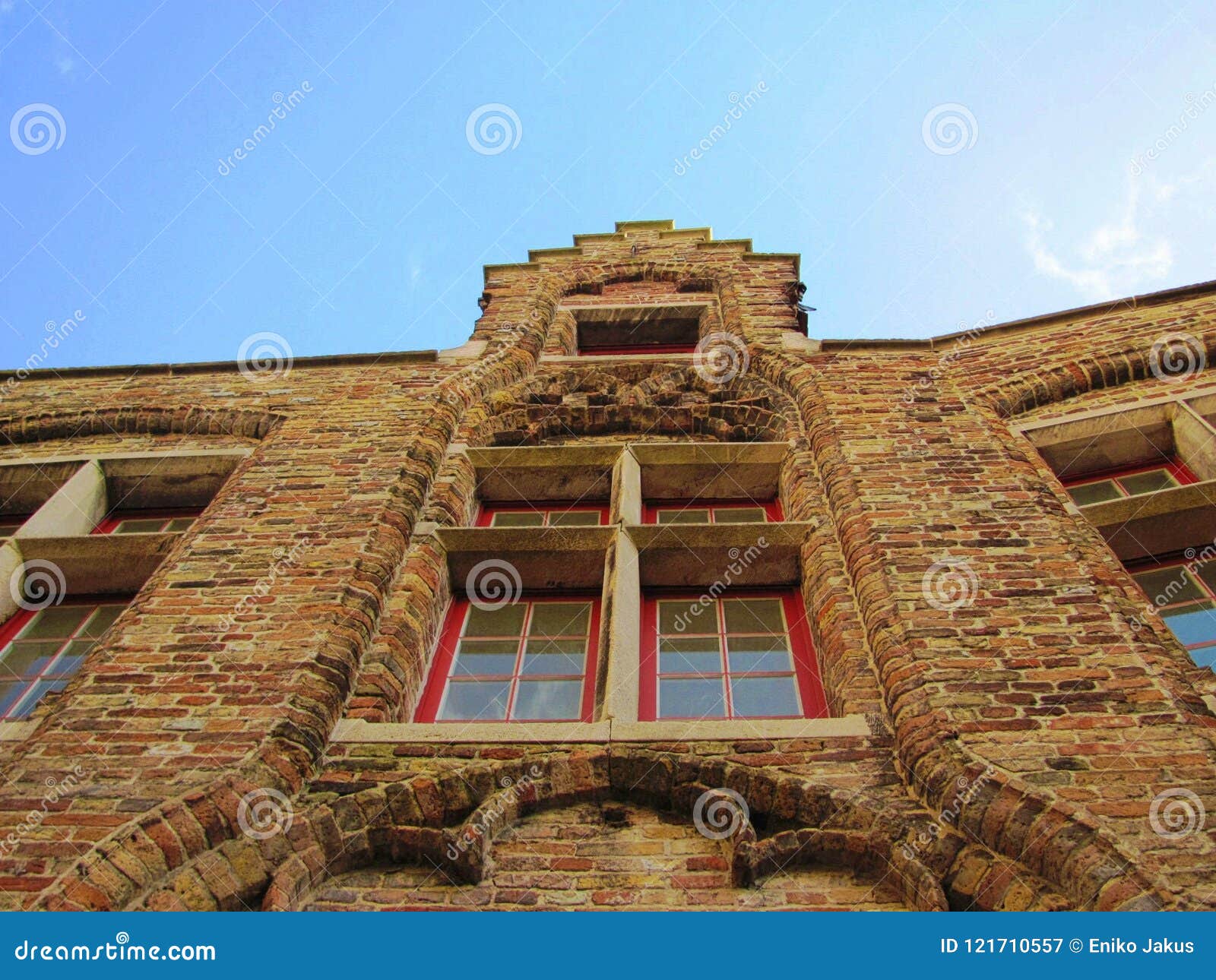 Building with Red Windows and Bricks and Blue Sky Stock Image - Image ...