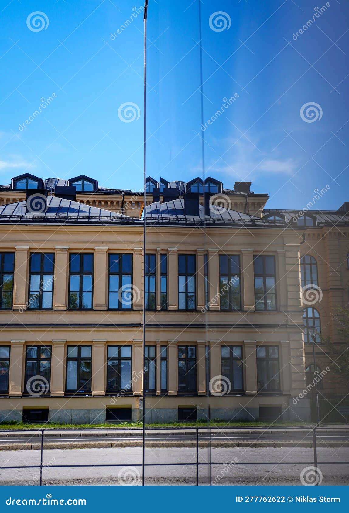 Building Reflected in a Window during Day Stock Photo - Image of ...