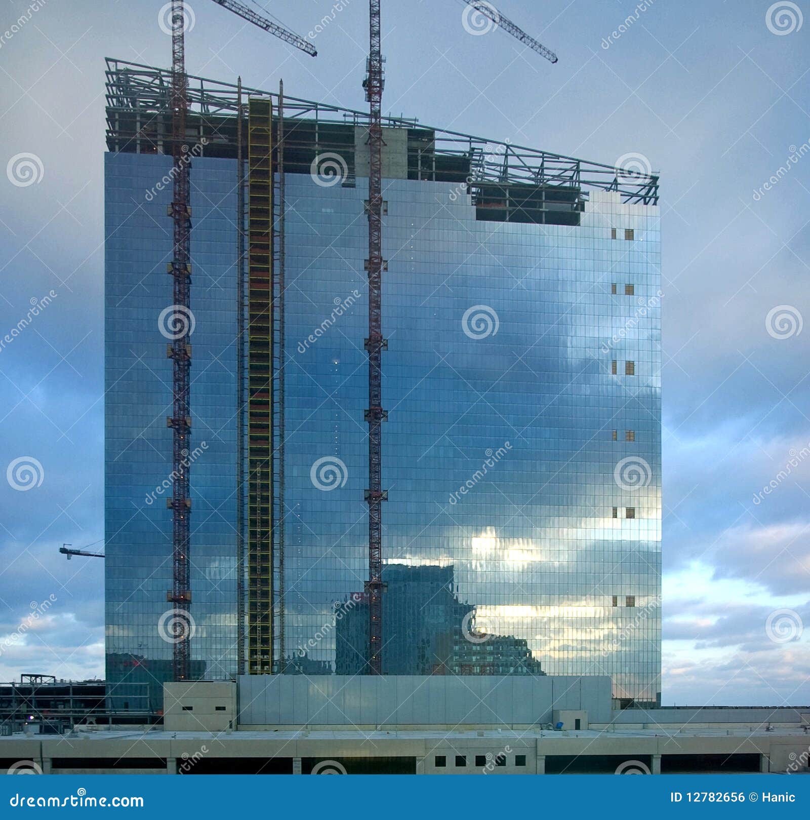 Building Reflections stock photo. Image of crane, clouds - 12782656