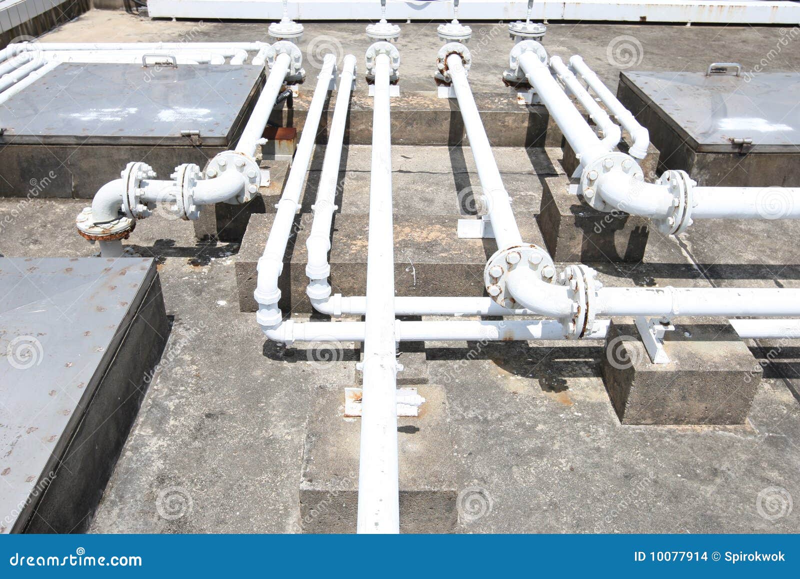 Building rooftop pipelines stock photo. Image of material - 10077914