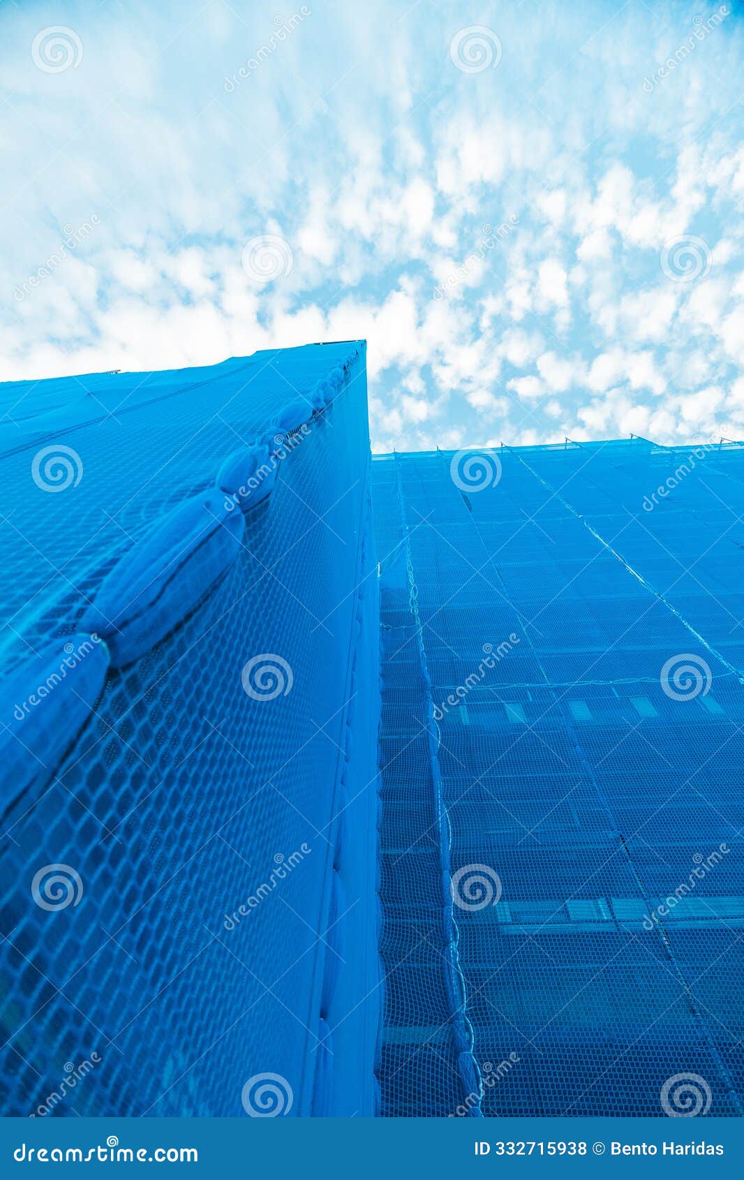 Building Scaffolding Frame with Blue Safety Net Stock Photo - Image of ...