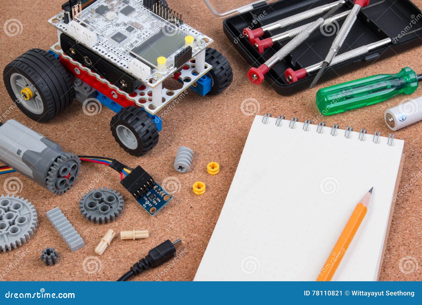 Building a Simple Car Robot with Microcontroller and Notebook. Stock ...