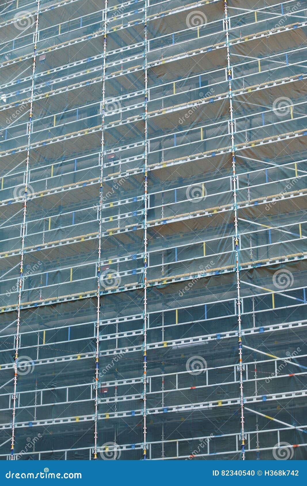 Building Site Facade with Scaffolds and Protection Mesh Stock Photo ...