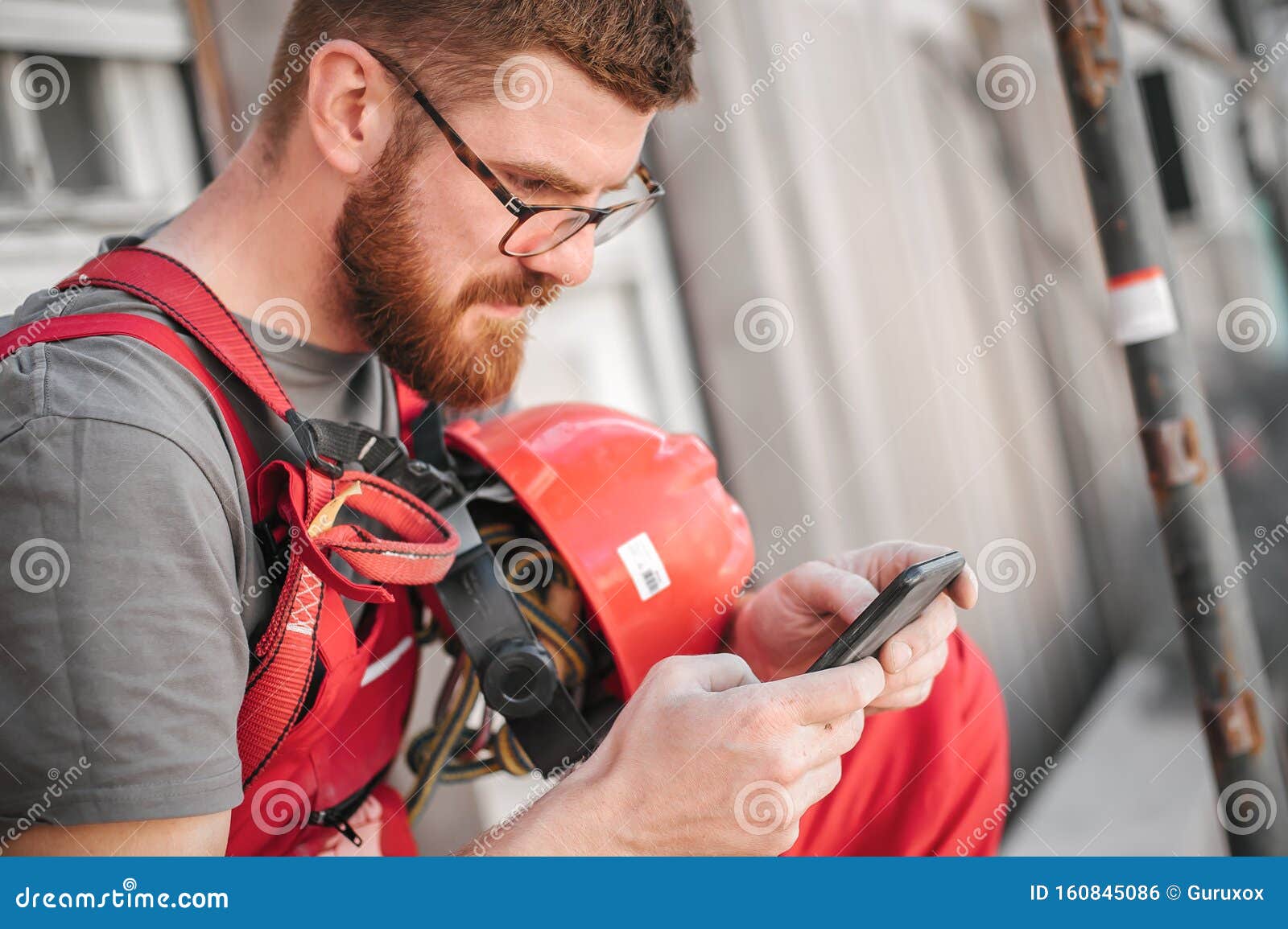 Building Site Worker on the Scaffolding Using Mobile Phone Stock Photo ...