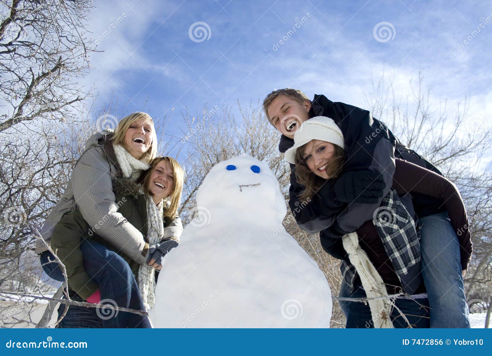 Building a Snowman stock photo. Image of people, cold - 7472856
