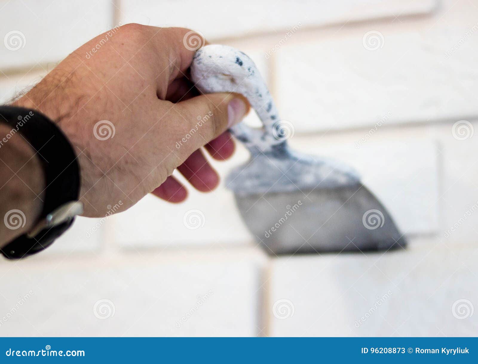 Building spatula in hand stock image. Image of background - 96208873