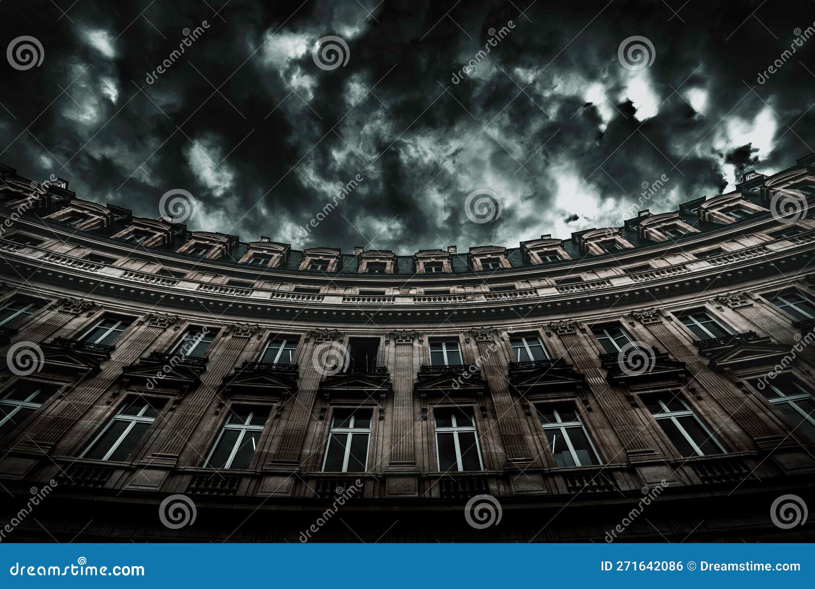 Building Standing with a Backdrop of Ominous Clouds Gathering in the ...