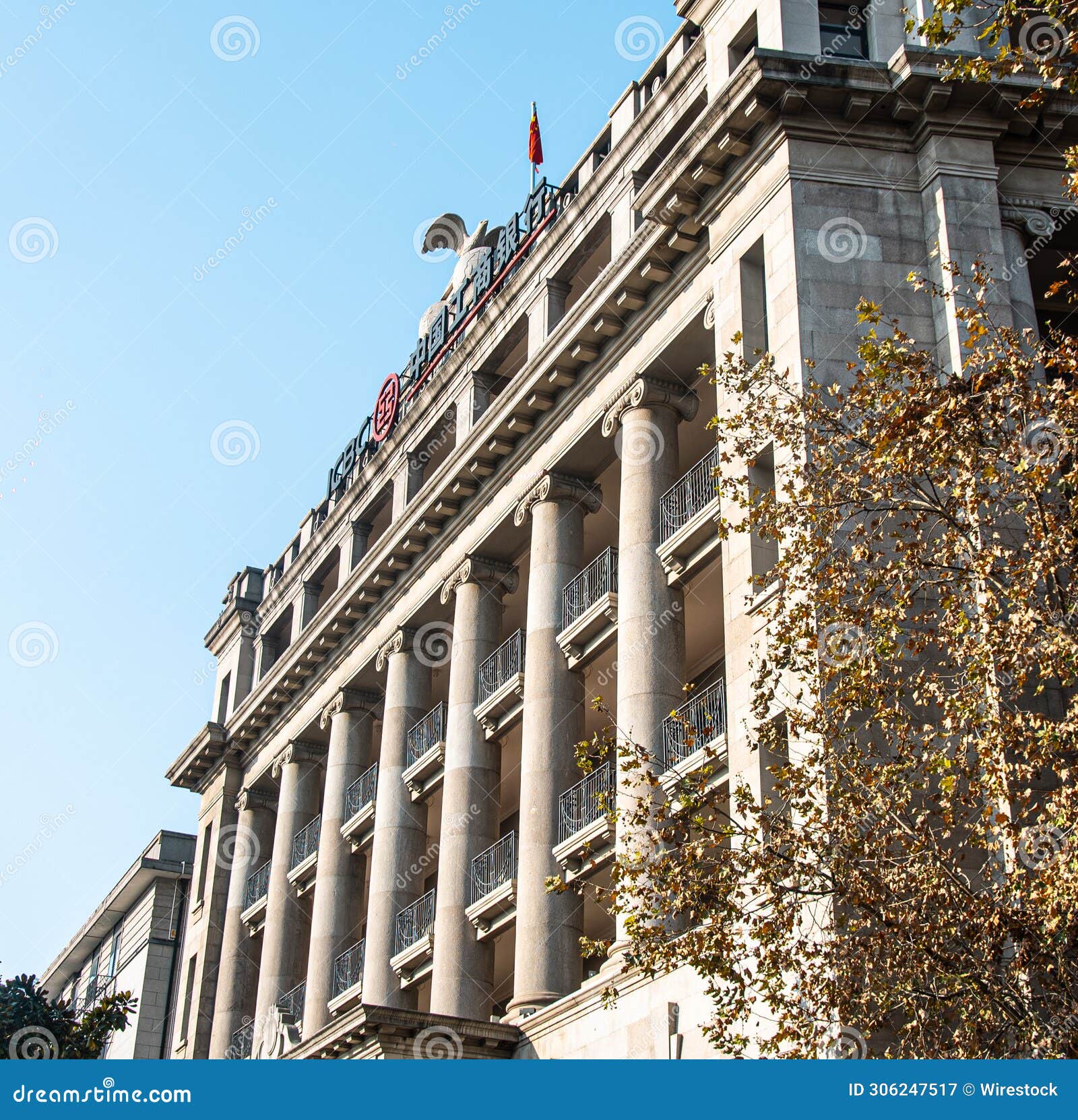 The Building with Stone Columns on it Has a Clock Tower at the Top ...