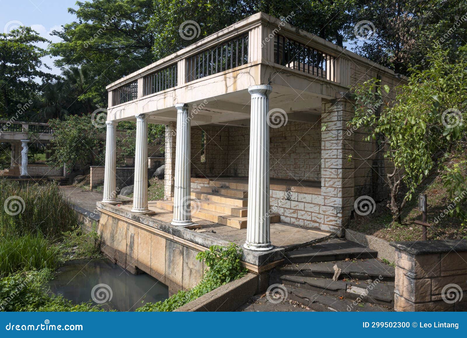 Building with Stone Pillars and a Terrace Above Stock Photo - Image of ...