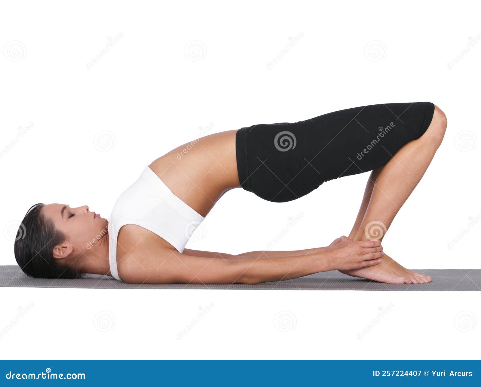 Building a Strong Back and Core. a Young Woman Doing Stretches while ...