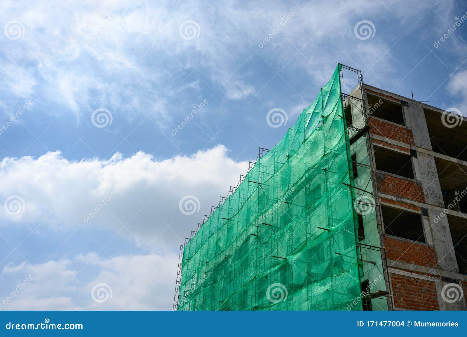 Building Structure with Netting Shade and Scaffolding Covered Stock ...