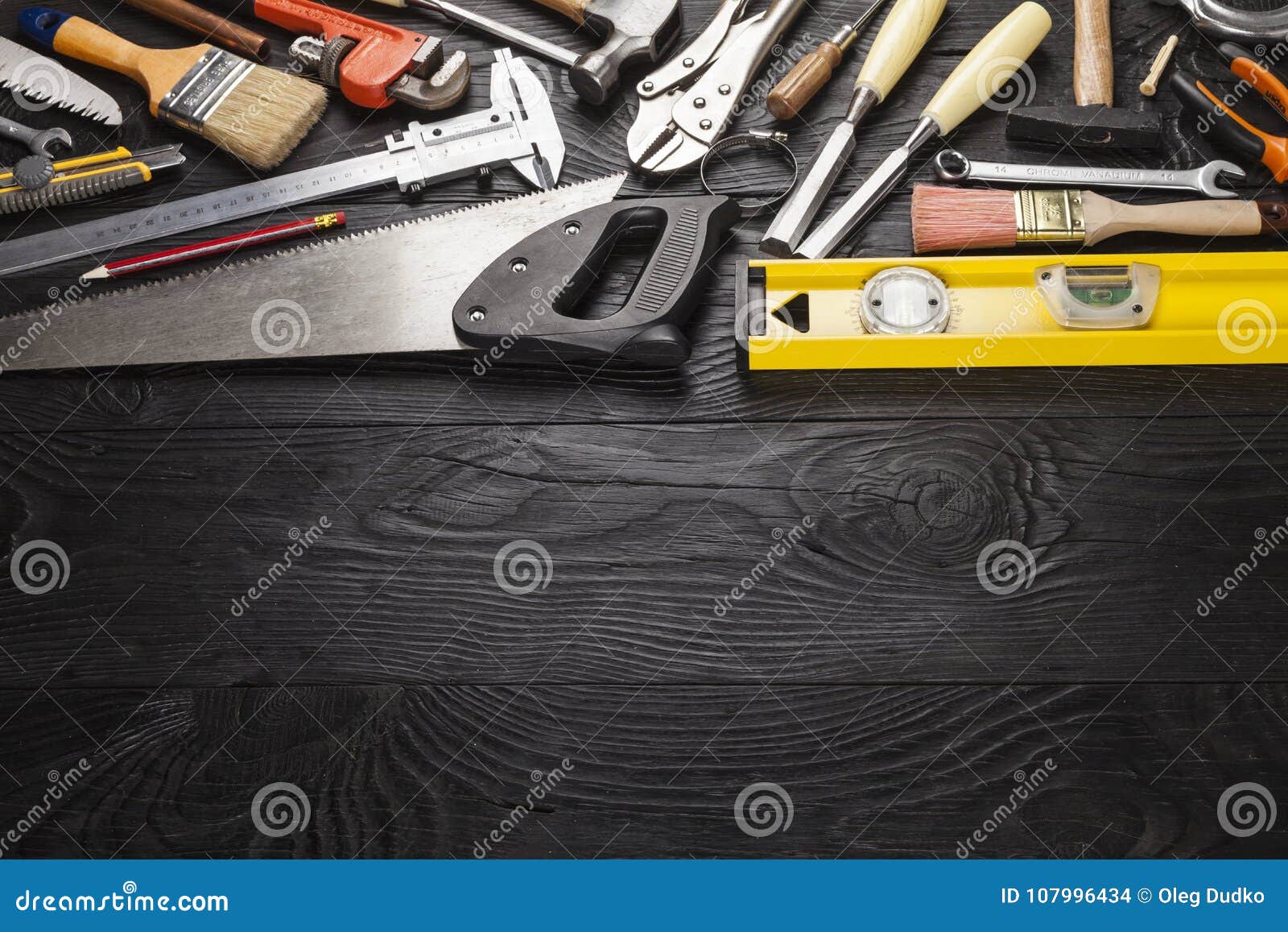 Various Building Tools on Black Wooden Background Stock Photo - Image ...
