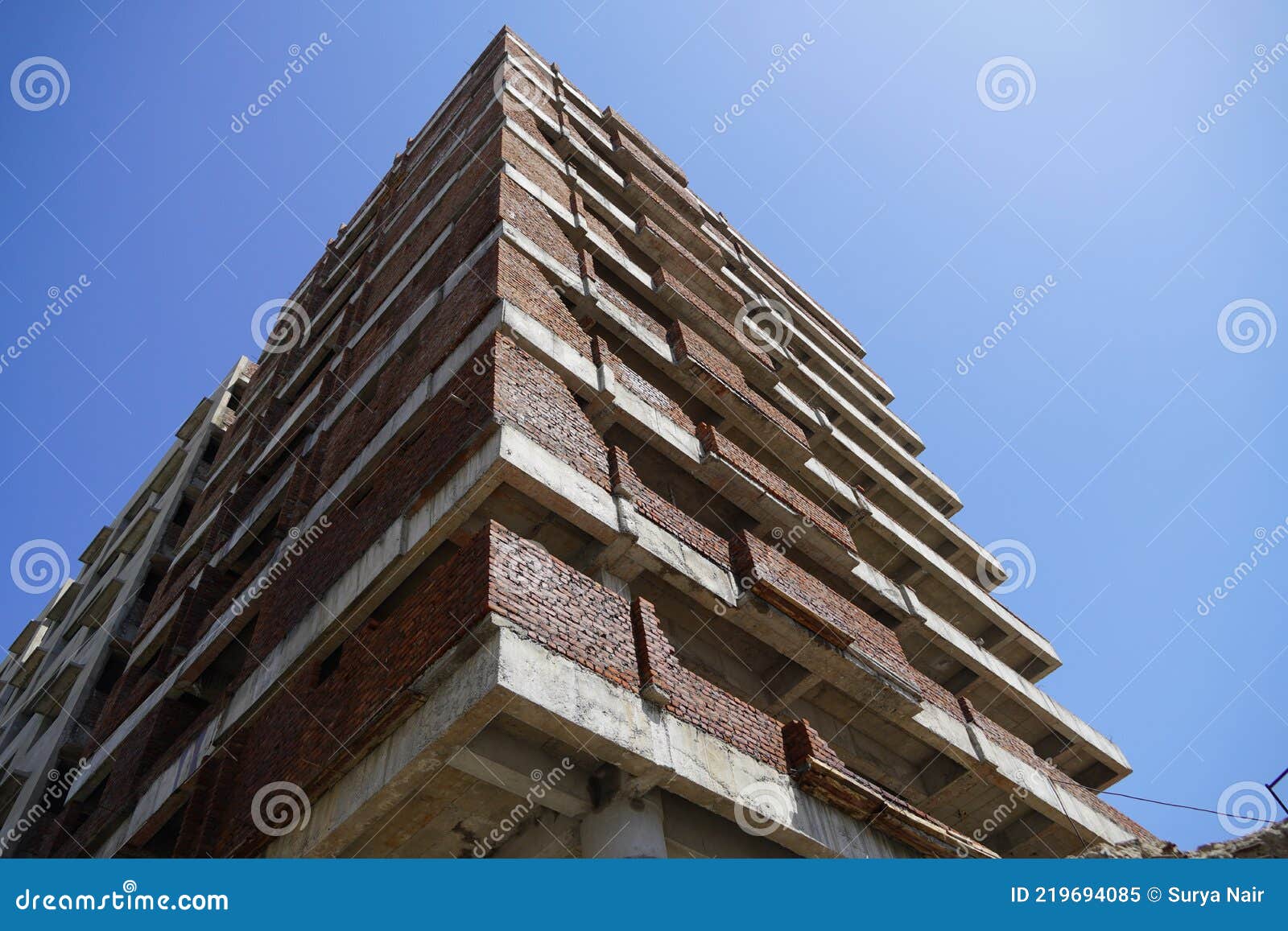 Building Under Construction Against Blue Sky. General View of the ...