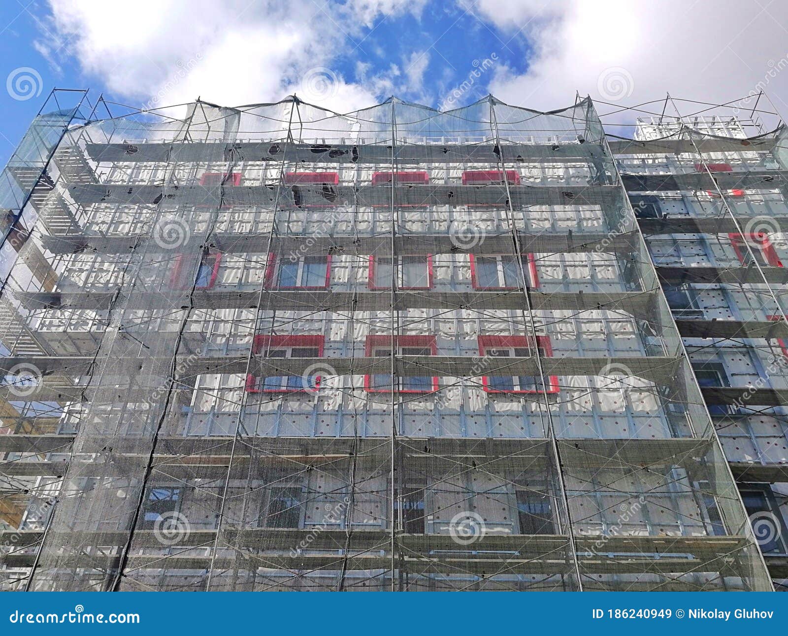Building Under Construction is Covered with Net for Security Against ...