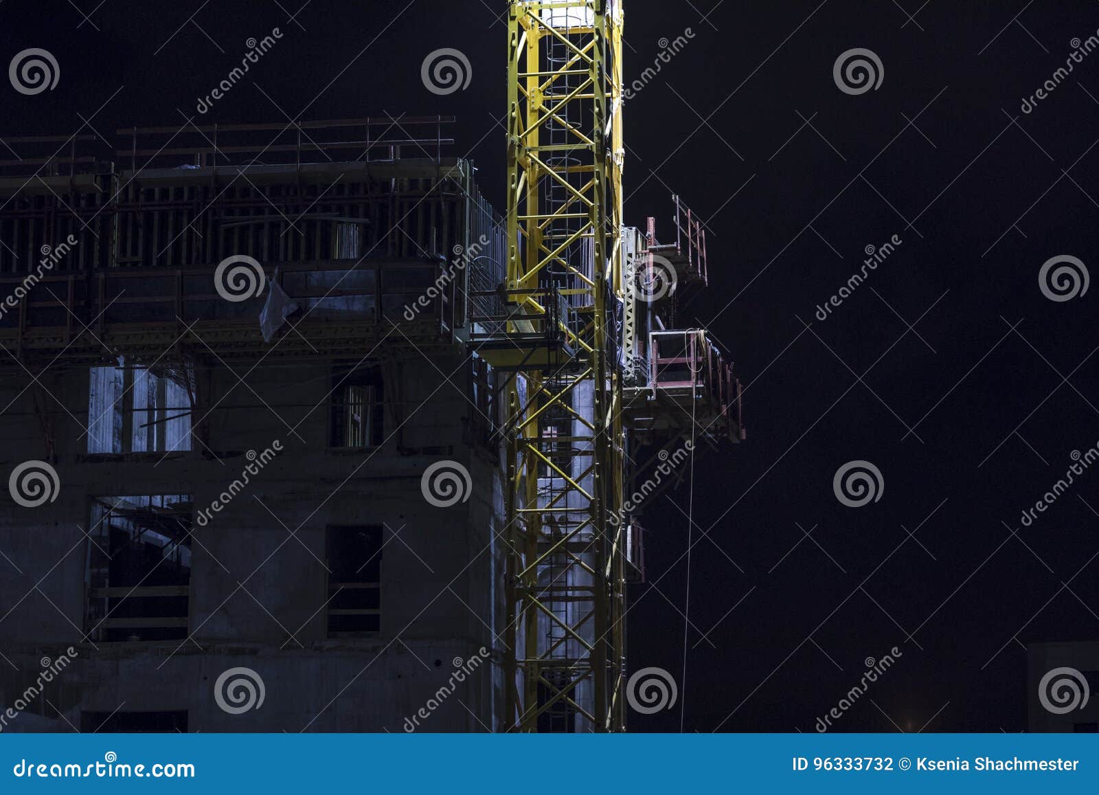 Building Under Construction with Crane Mast at Night Stock Photo ...