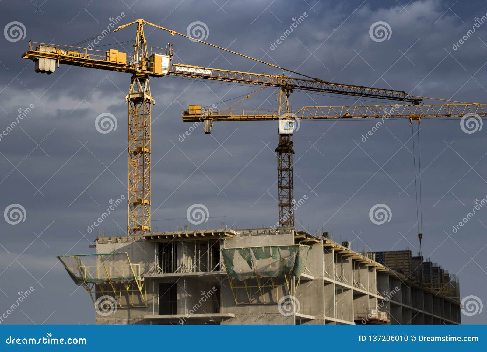 Building Under Construction with Cranes Against the Sky Stock Photo ...