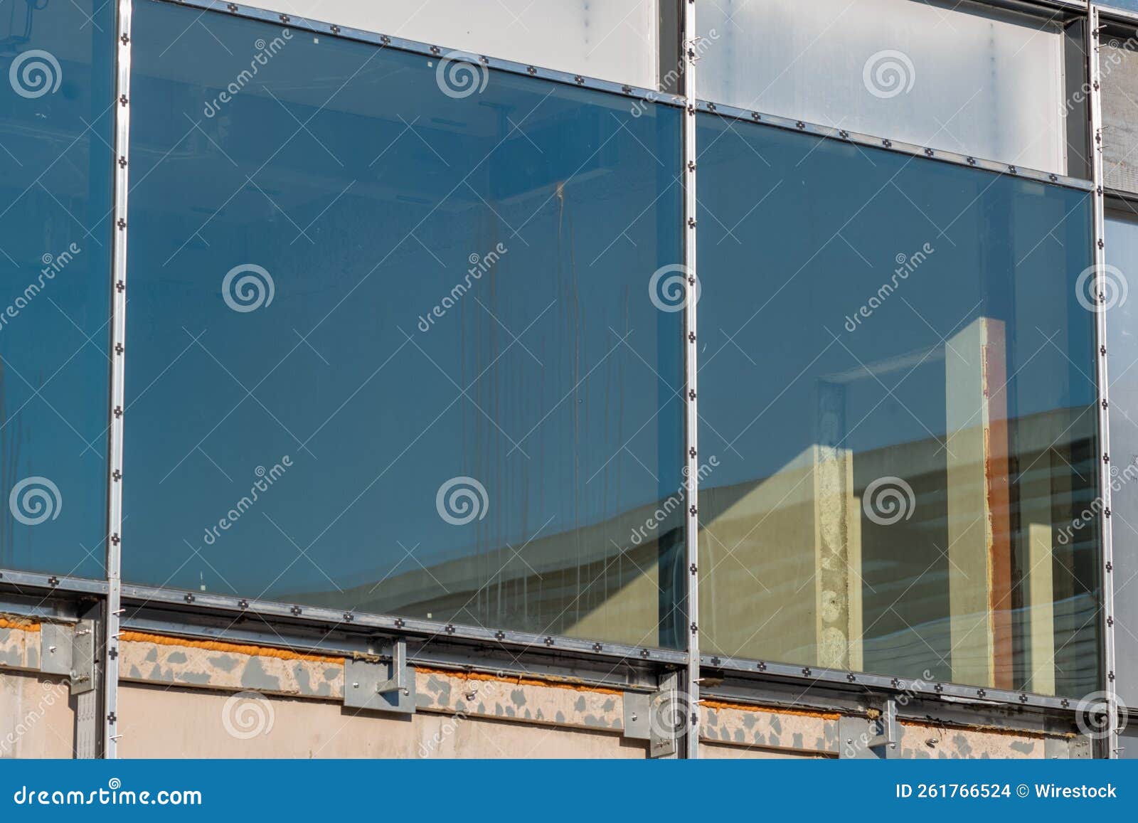 Building Under Construction with Huge Windows and Gray Walls Inside ...