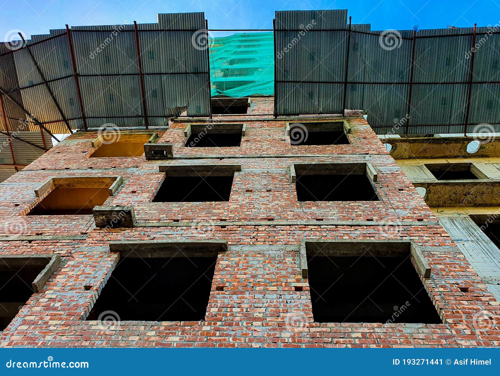 Building Under Construction - A Multi Storied Apartment Building Under ...