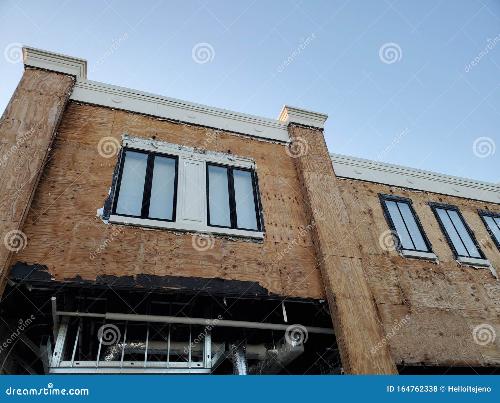 Building Under Construction with Raw Wood and Windows Stock Photo ...