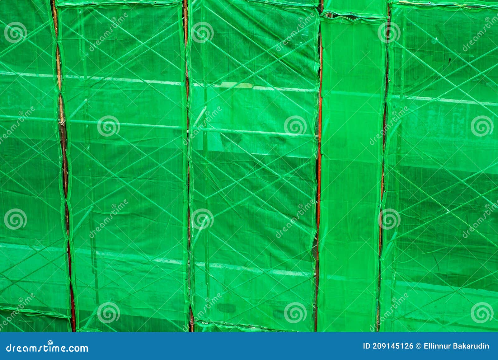 Building Under Construction Wrapped in a Green Net for Safety Stock ...