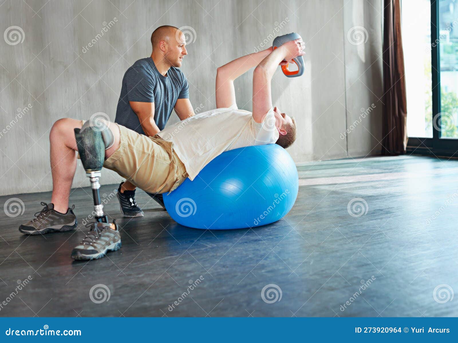 Building Up His Strength. Studio Shot of a Young Amputee Training in a ...