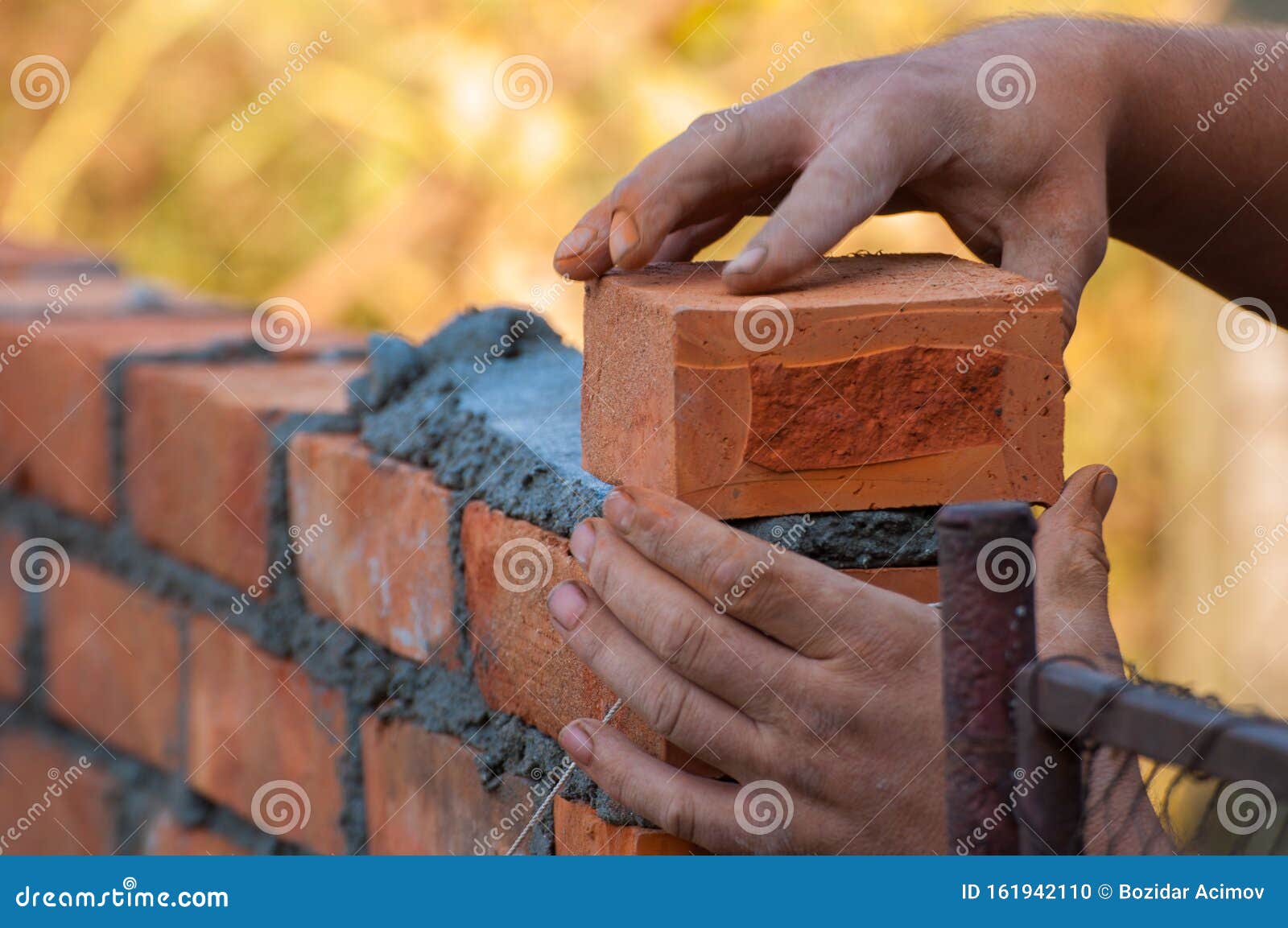 Building a Wall with Red Brick. Working with Bricks for Building a Wall ...