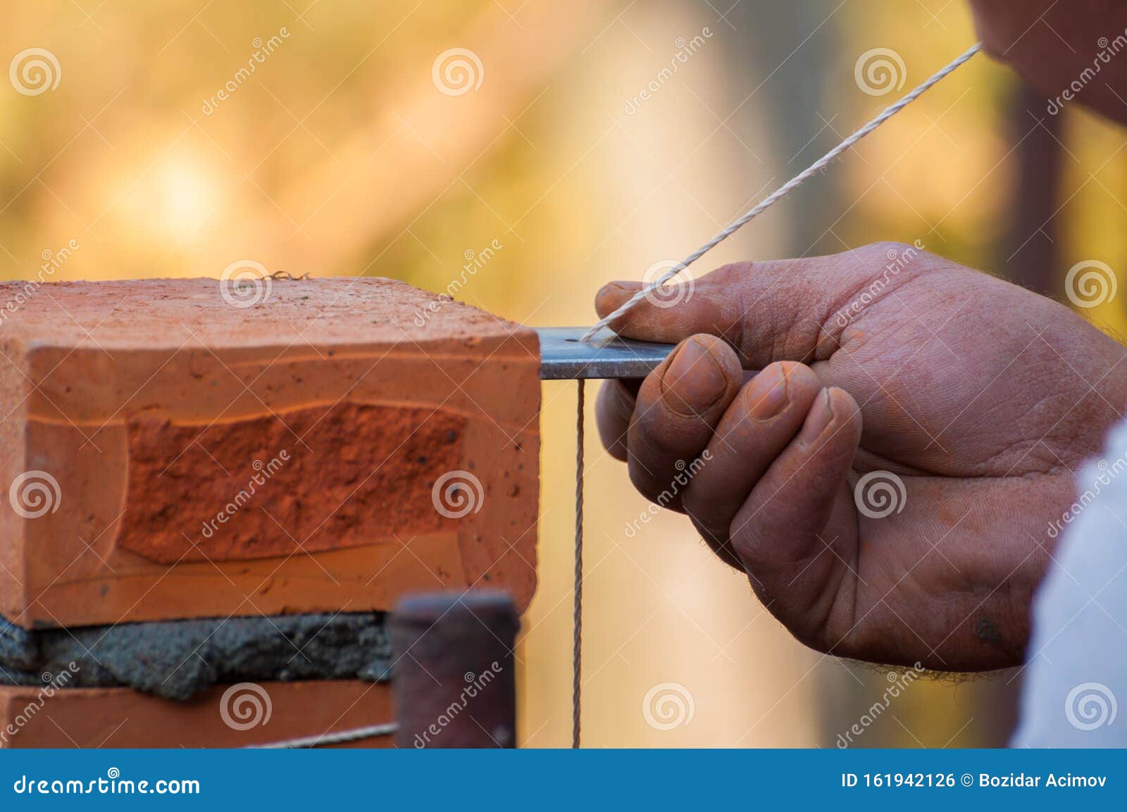Building a Wall with Red Brick. Working with Bricks for Building a Wall ...