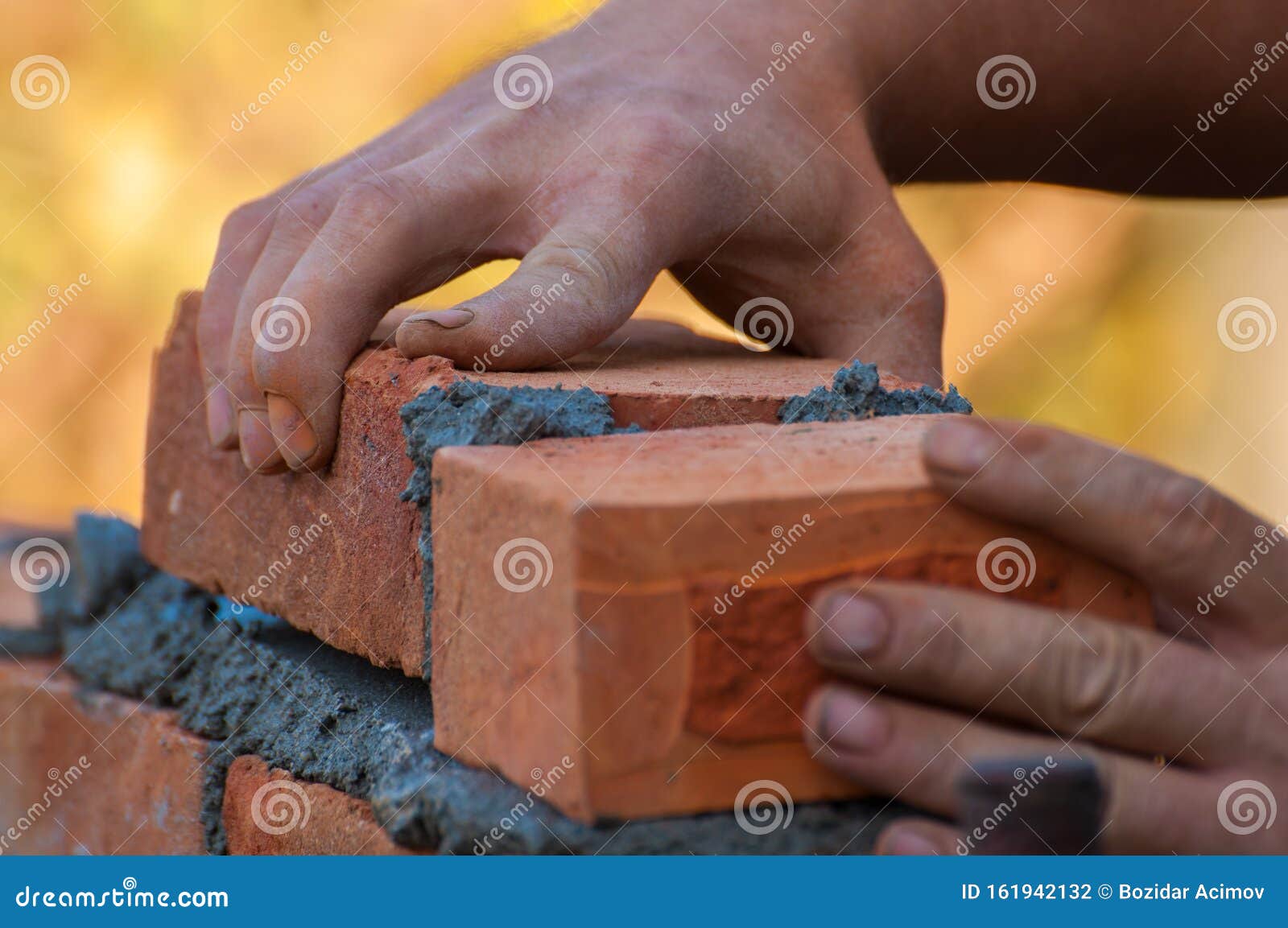 Building a Wall with Red Brick. Working with Bricks for Building a Wall ...