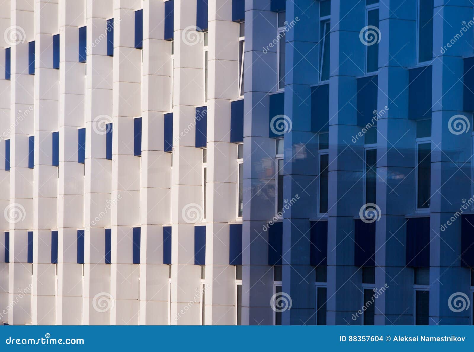 Building with Windows in the Shade and in the Sun Stock Photo - Image ...