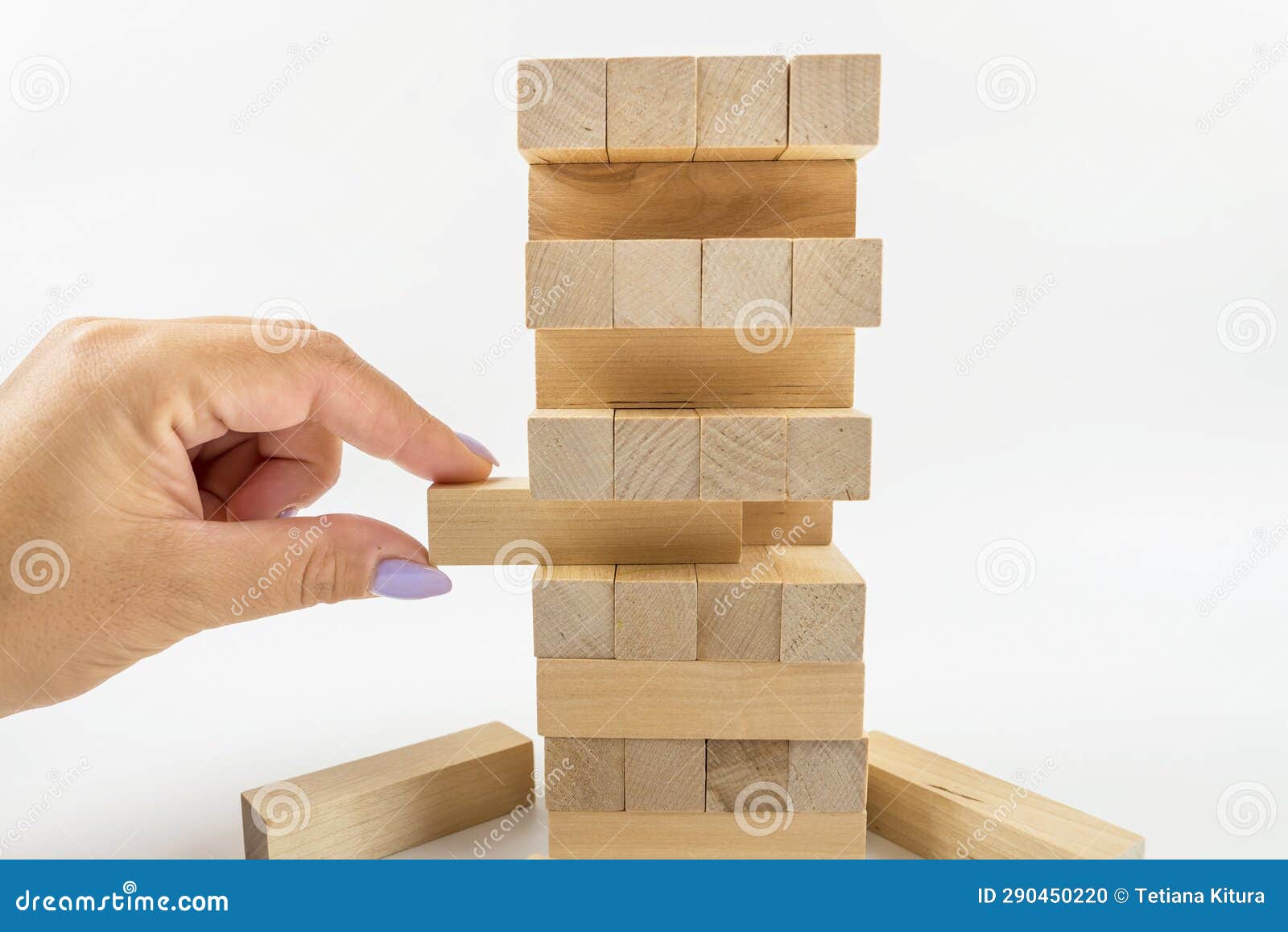Building from Wooden Blocks. Wood Blocks Stack Game with Hand on ...