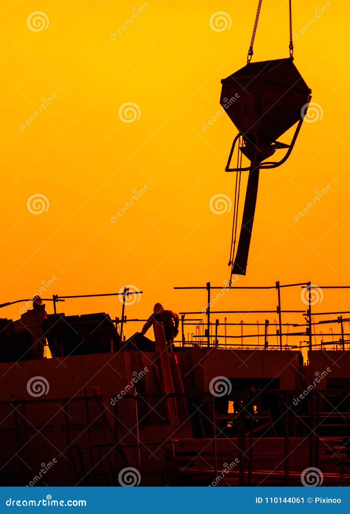 Building Workers Working on a Building Under a Sunset Stock Image ...