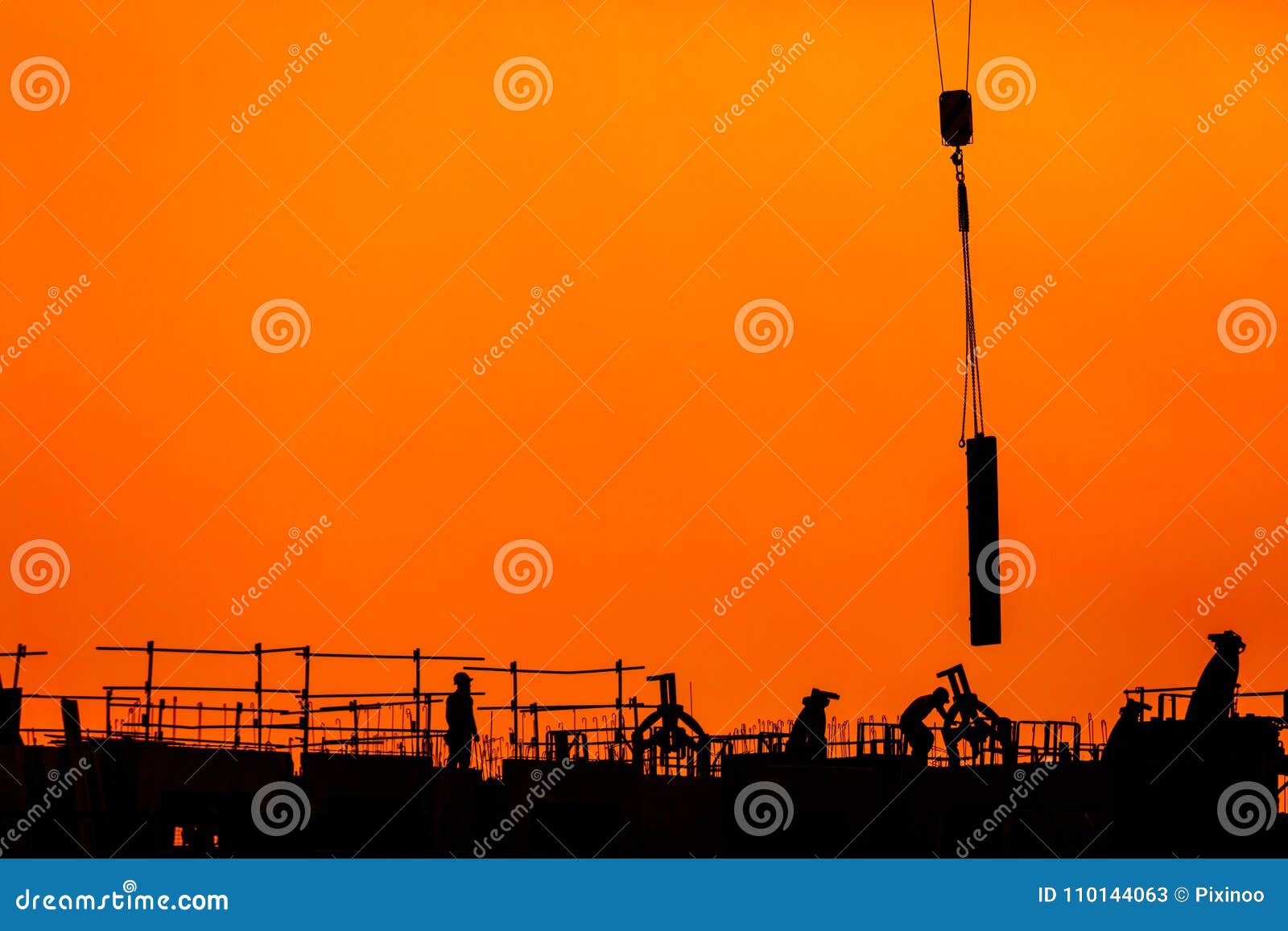 Building Workers Working on a Building Under a Sunset Stock Image ...