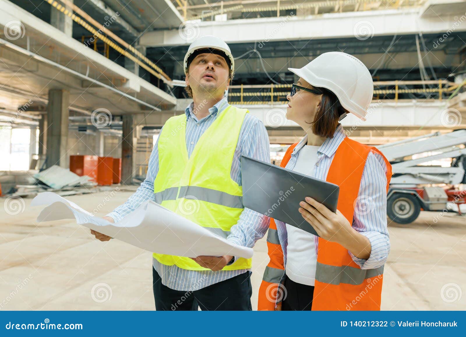 Building Workers Working at Construction Site, Builders Looking in ...