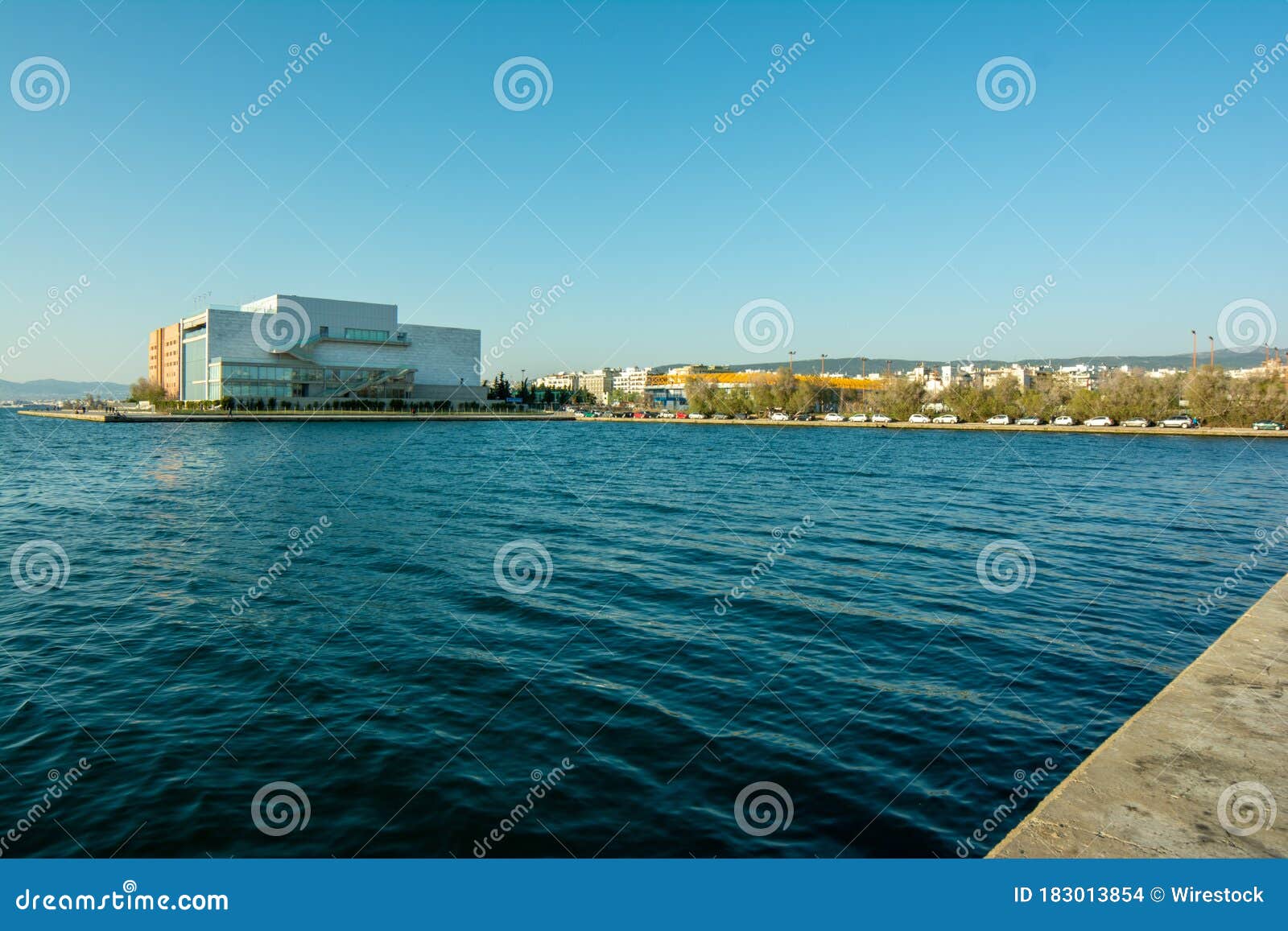 Buildings of the City and Trees in Front of the Water Editorial Stock ...