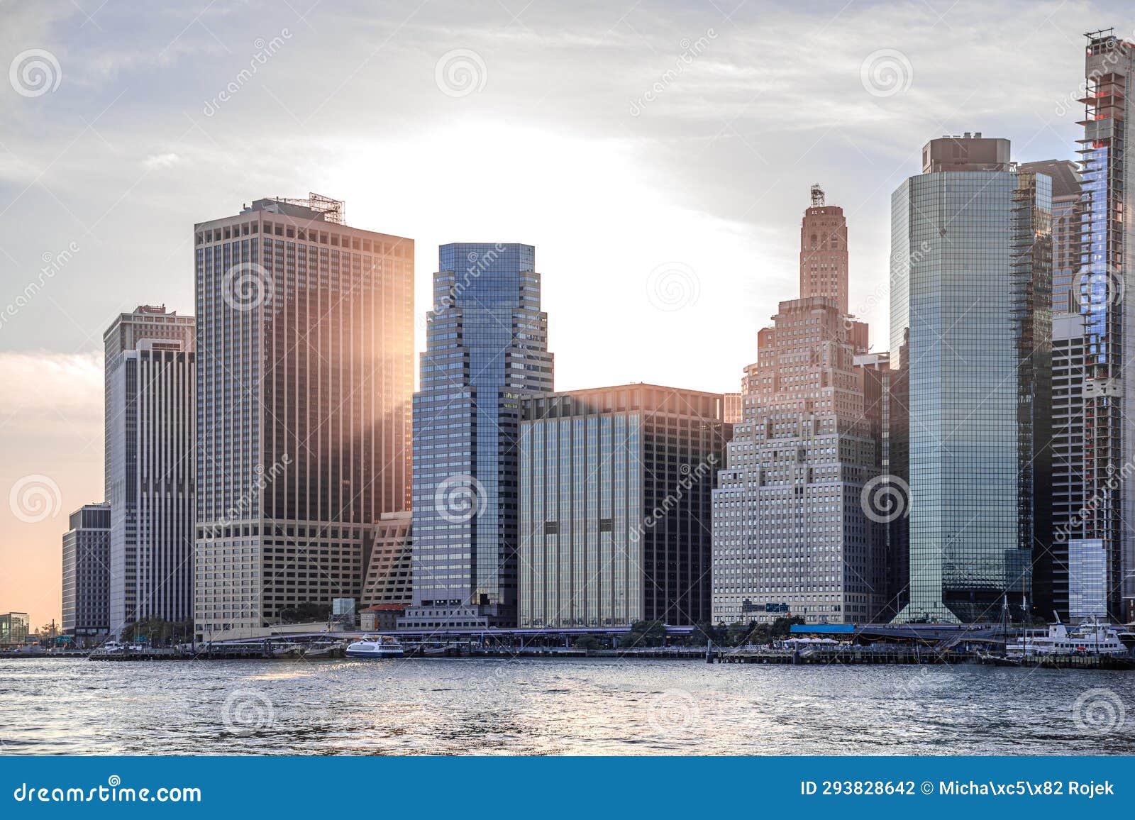 Buildings in Manhattan with the Piercing Sun Light Rays of the Setting ...