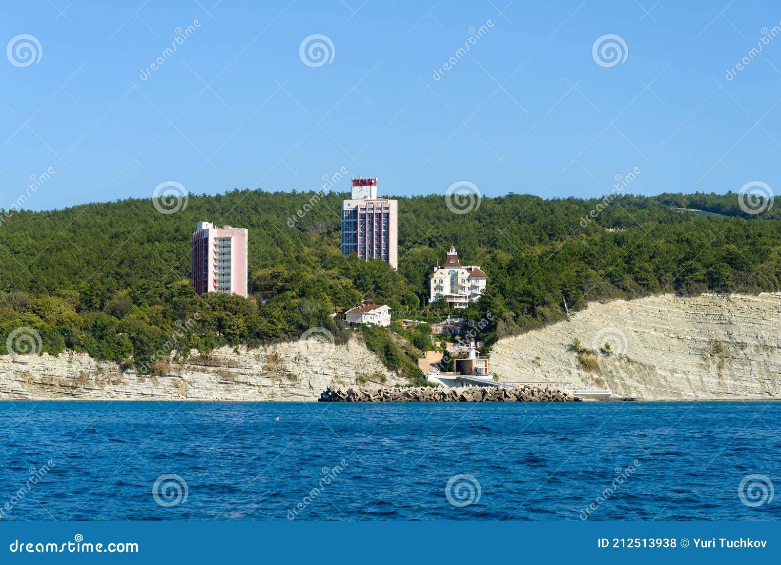 Buildings on the shore stock photo. Image of sunny, rock - 212513938