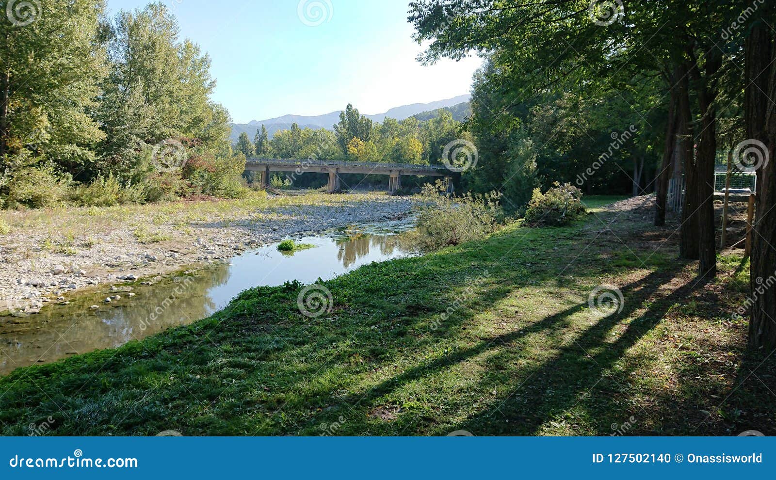 Bridge crossing a river stock photo. Image of crossing - 127502140