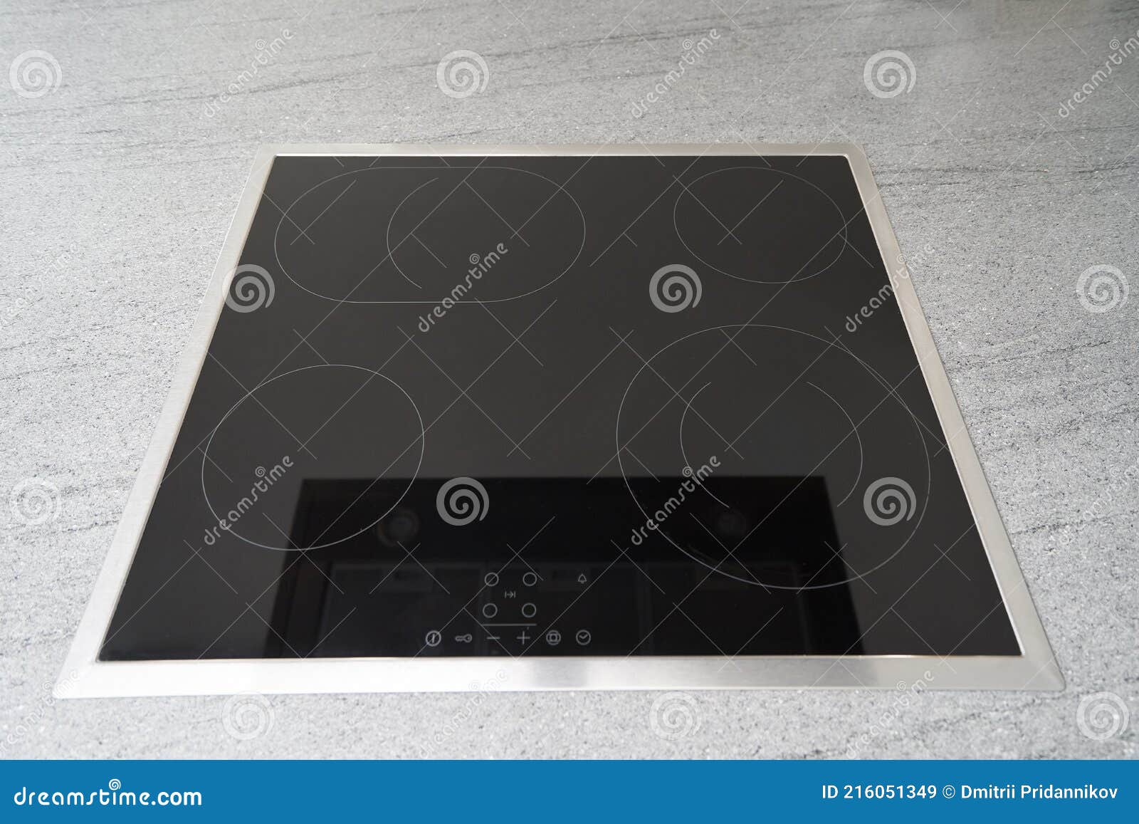 Built-in Induction Cooker with a Black Glass Surface in the Kitchen ...